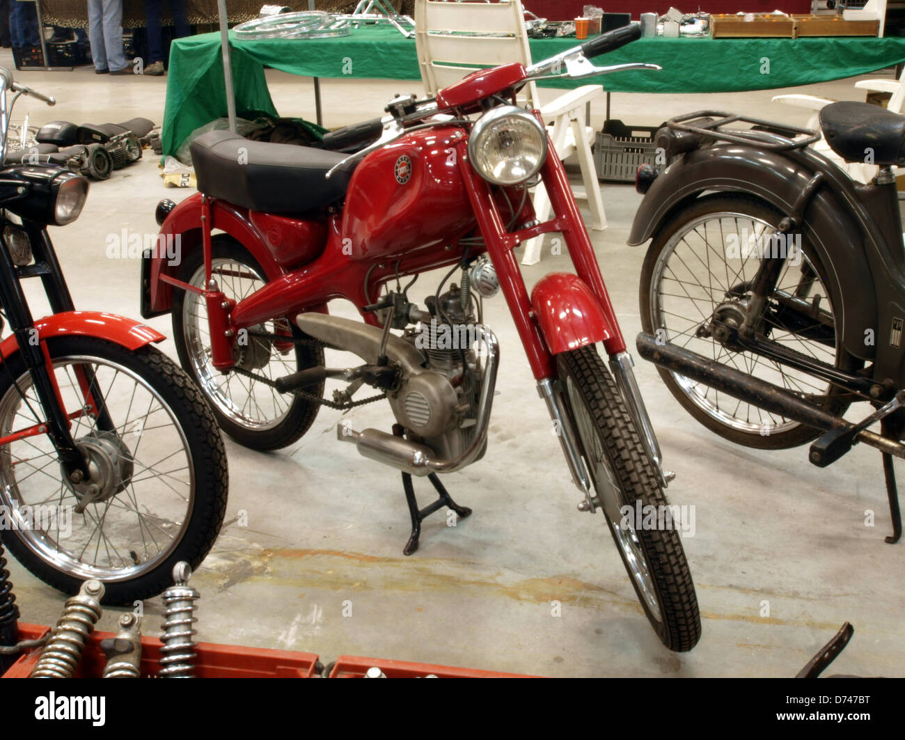 The Red Motom moped is a vintage two-wheeled vehicle known for its ...