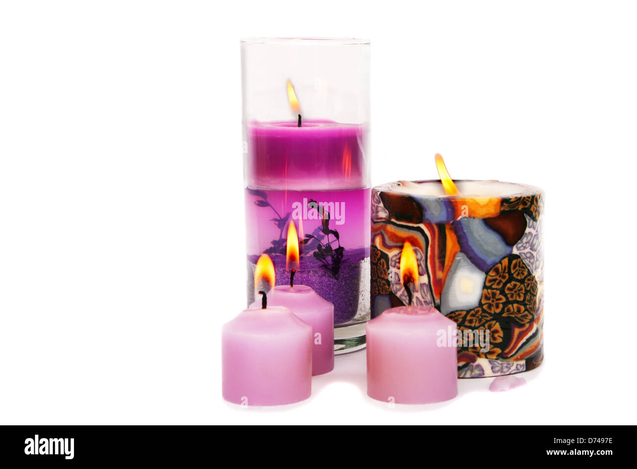 Pink burning candles isolated on white background Stock Photo - Alamy