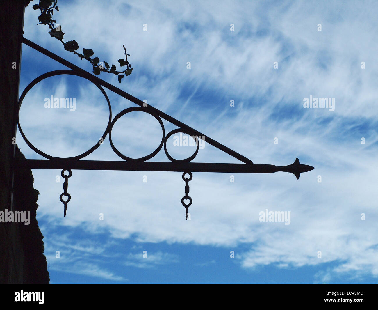 Bracket for shop sign showing sky and clouds Stock Photo - Alamy