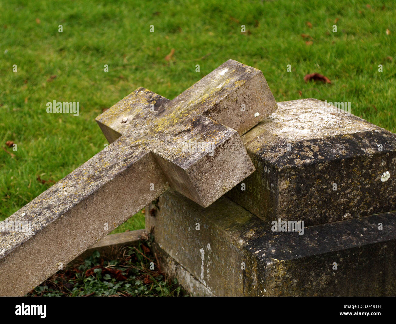 Stone cross on grave in graveyard Stock Photo - Alamy
