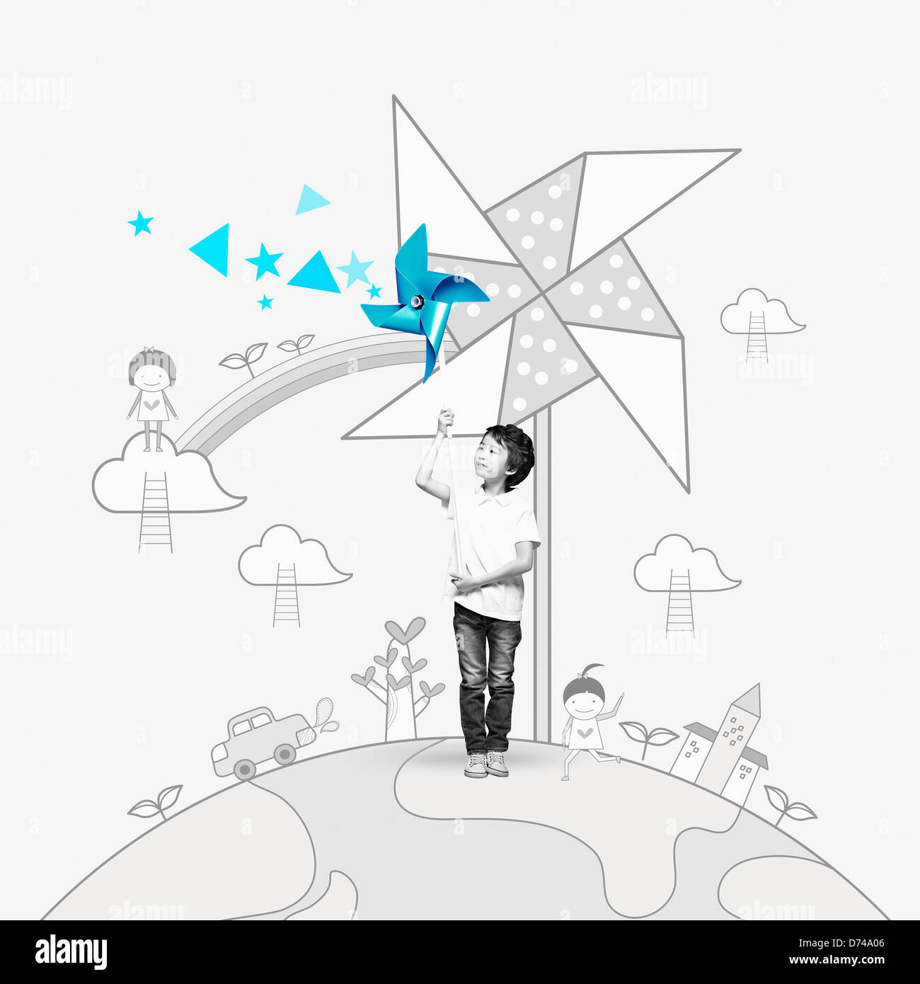 a boy holding a pin wheel Stock Photo - Alamy