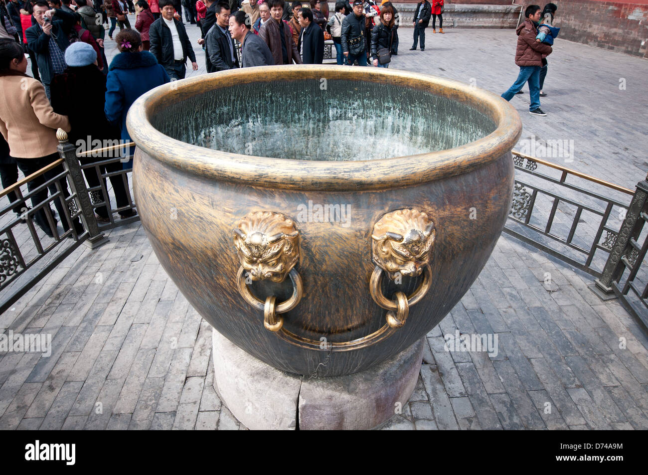 Big bronze water bowl with lion heads in Forbidden City, Beijing, China ...