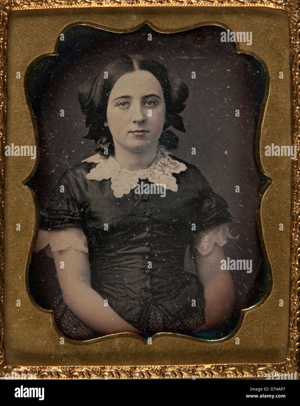 A 1850 portrait of a young woman, captured in the daguerreotype style ...