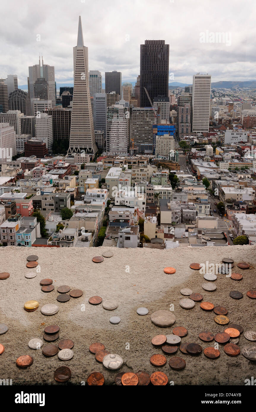 Coins from around the world on a window ledge with the financial ...