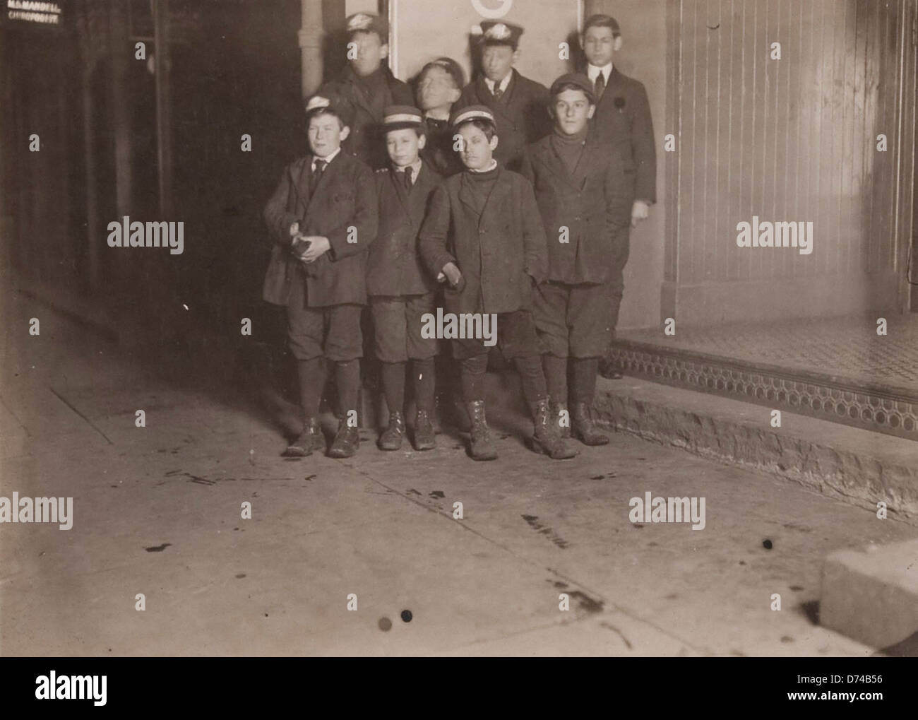 A 1909 photograph of eight messenger boys in New Haven, Connecticut ...