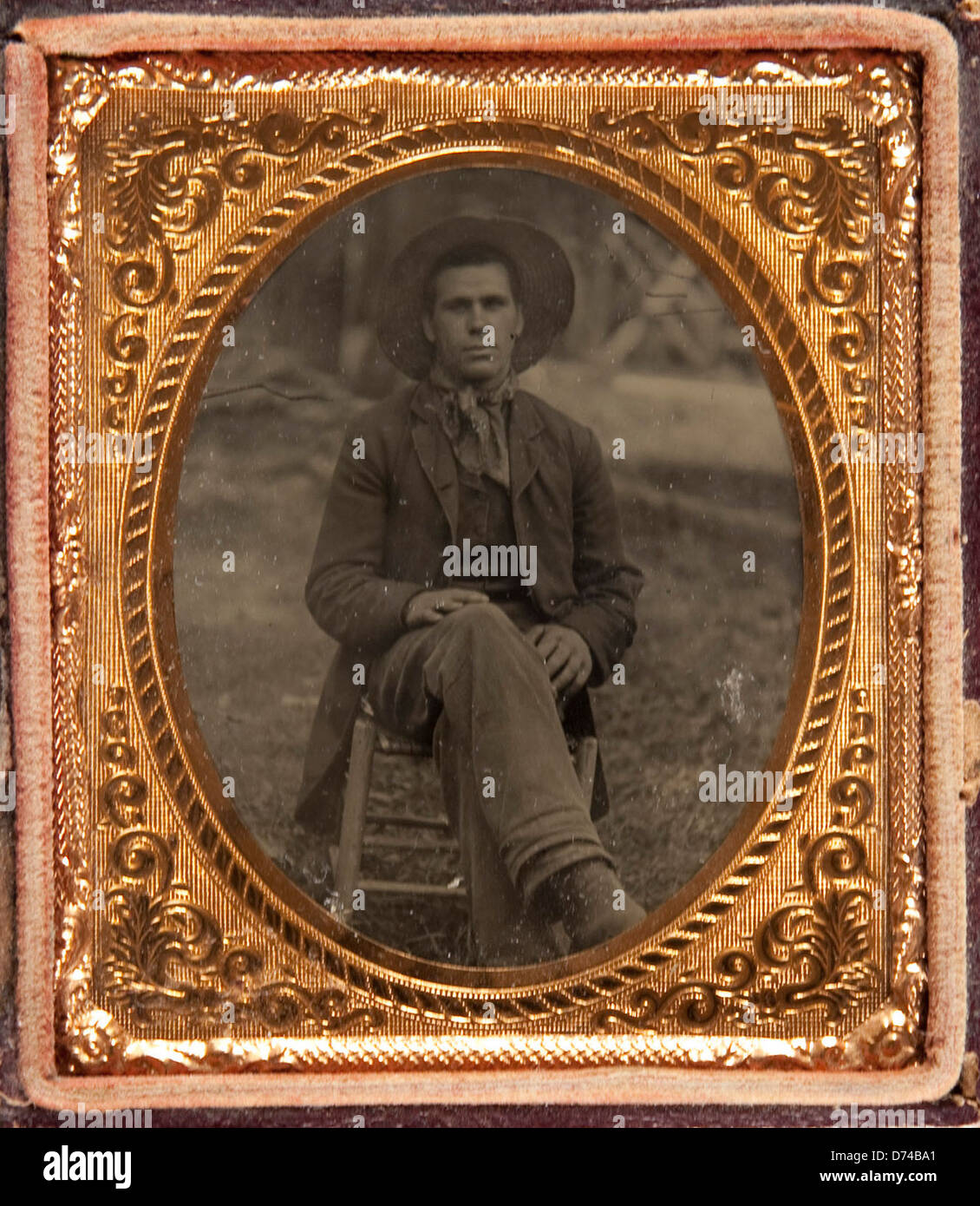 A tintype portrait of a cowboy from 1880, featuring a man seated with a ...
