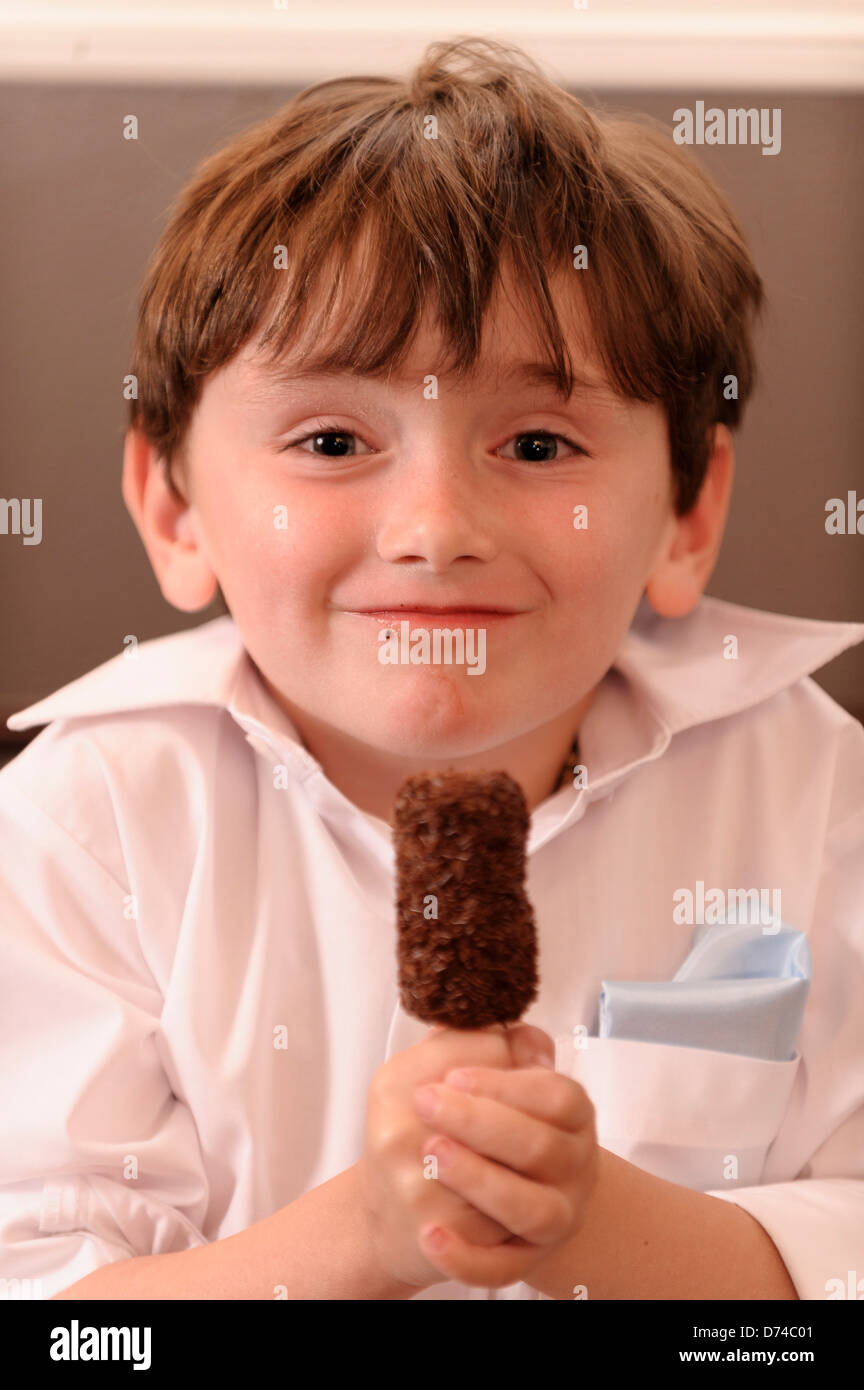 Happy young boy candy stick hi-res stock photography and images - Alamy