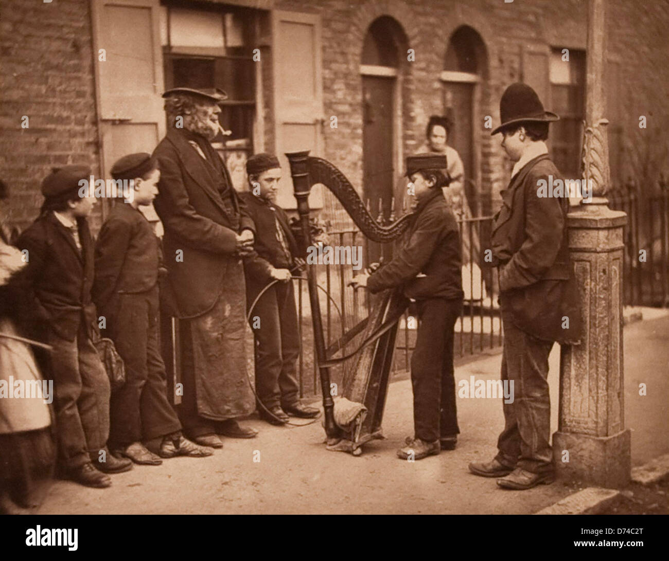 This photograph captures Italian street musicians performing in London ...