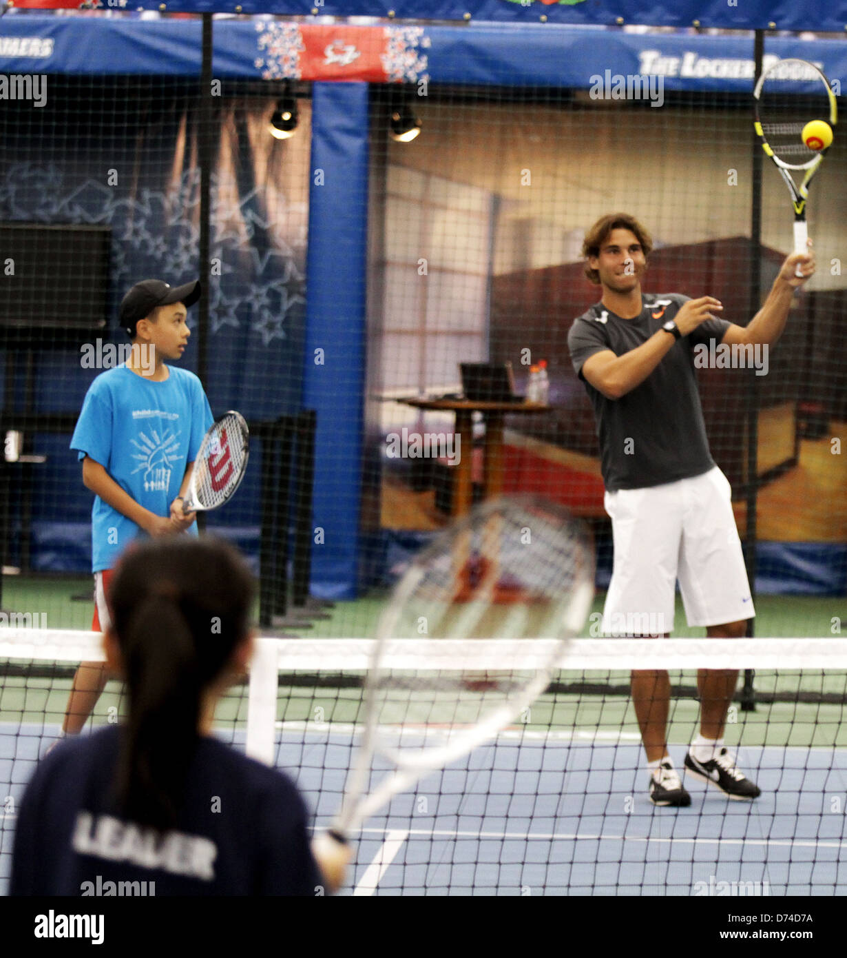 Rafael Nadal participating in a tennis clinic with children from The ...