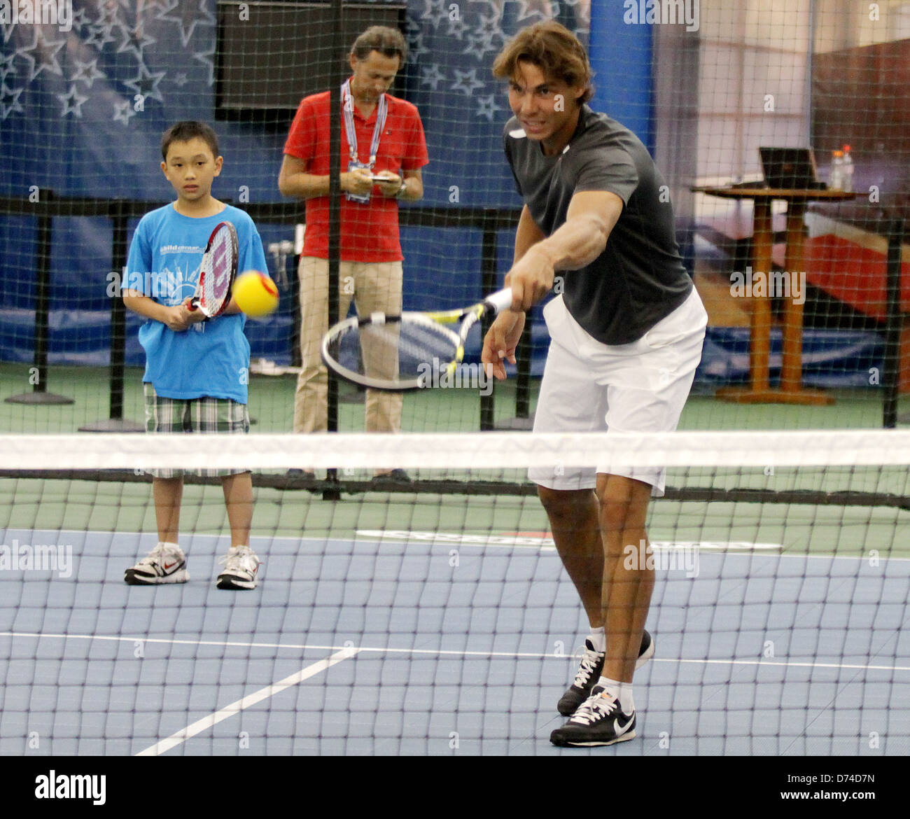 Rafael Nadal participating in a tennis clinic with children from The ...