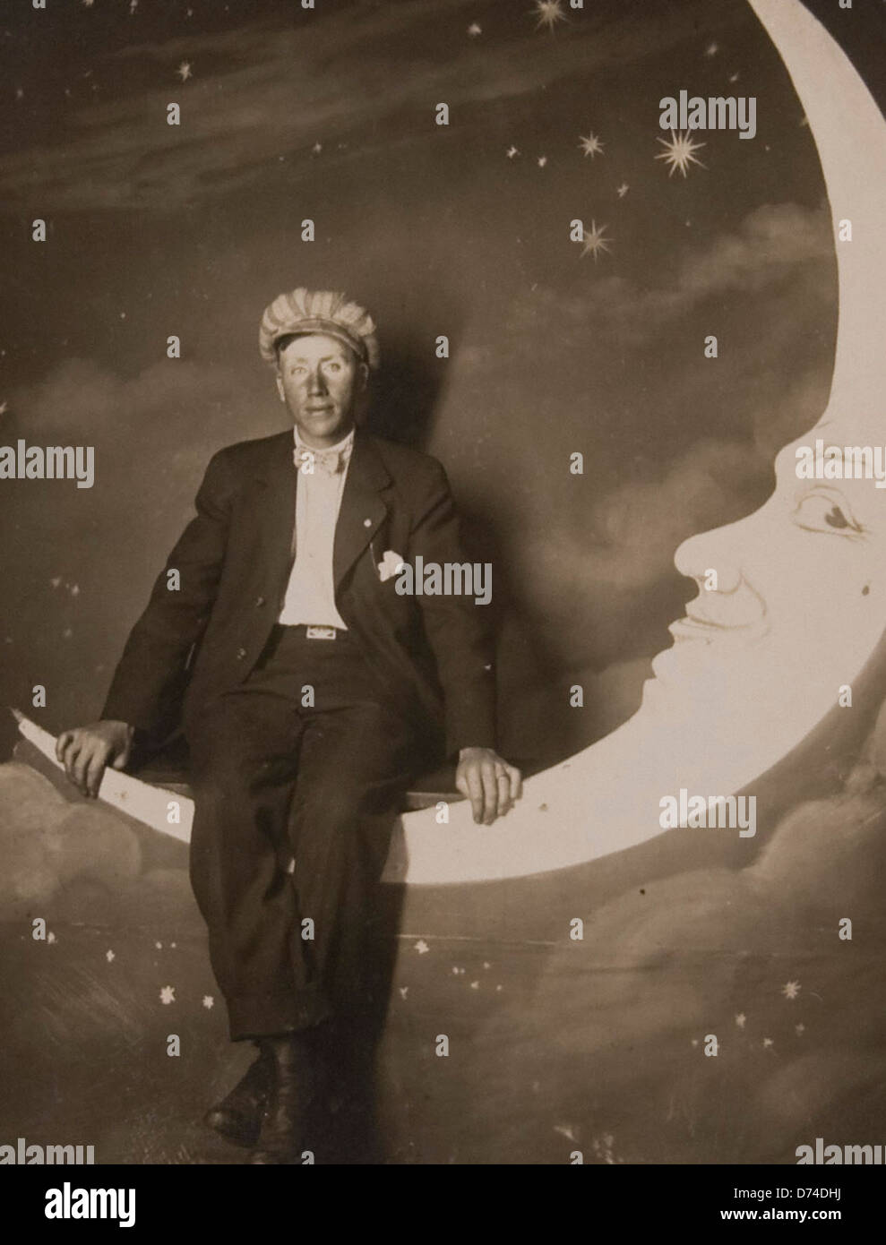 Untitled (man on crescent moon Stock Photo - Alamy