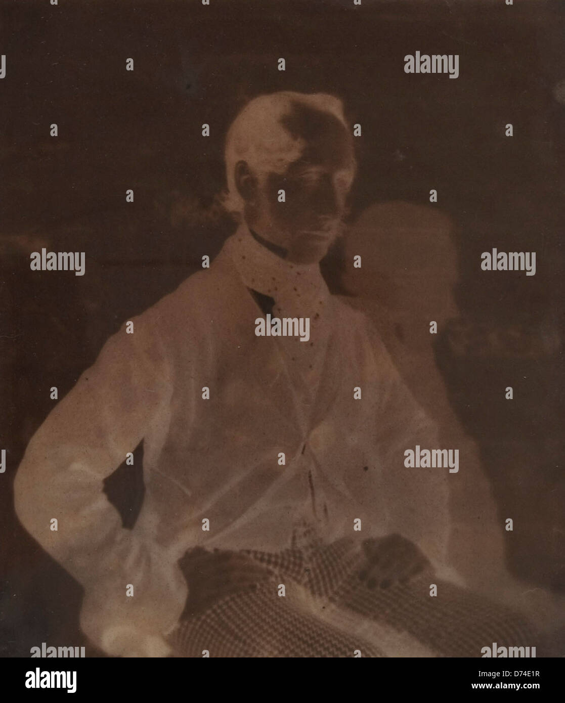 This untitled portrait shows a man in a classic pose, captured in a ...