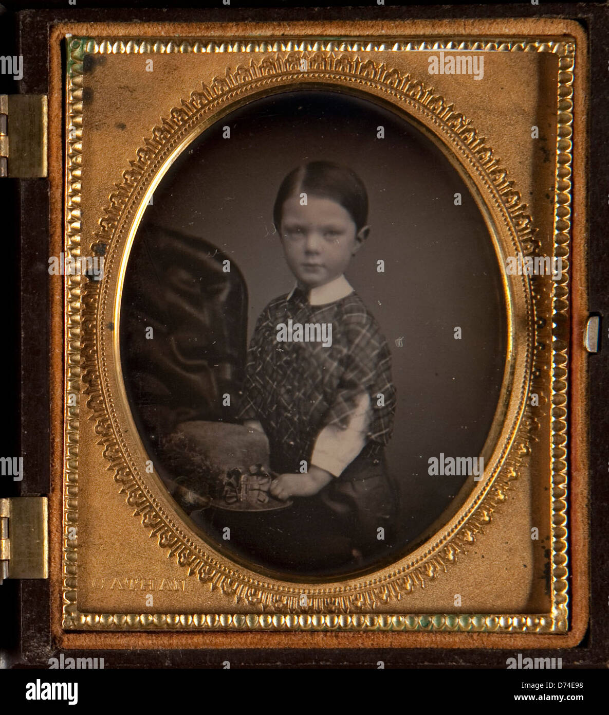 This 1850s portrait of a young boy, captured in a daguerreotype frame ...
