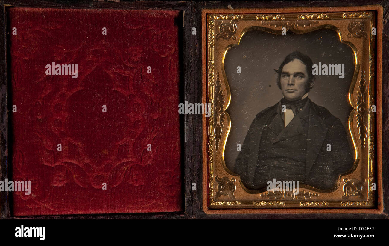 This historical portrait captures a man in a formal frame. The image ...