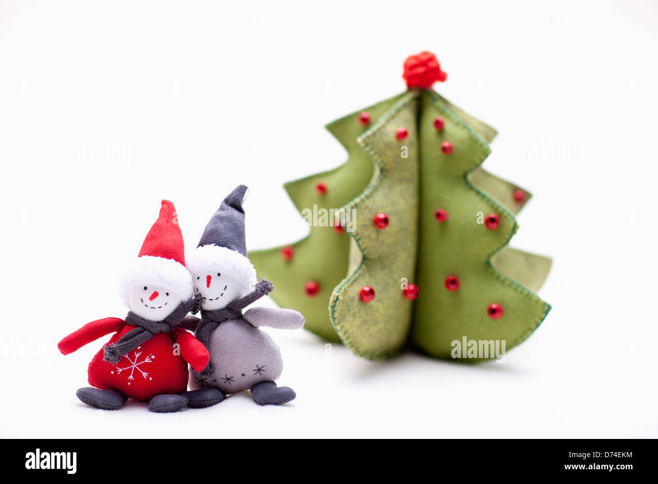 stuffed dolls and tree in white background Stock Photo - Alamy
