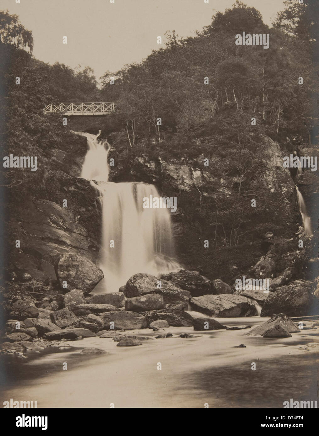 Inversnaid Falls, located in Scotland, is depicted in a photograph by ...