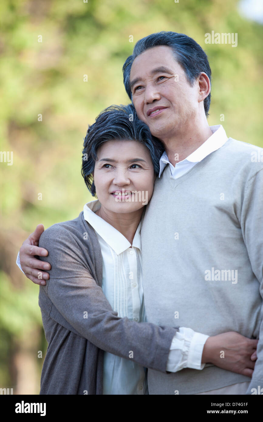 middle aged couple in each other's arm smiling Stock Photo - Alamy
