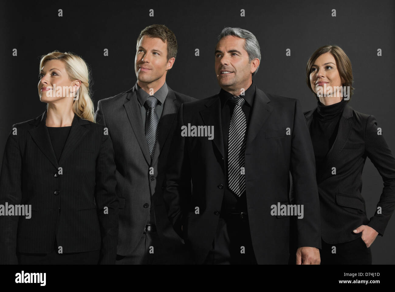 Men and women against black background Stock Photo - Alamy