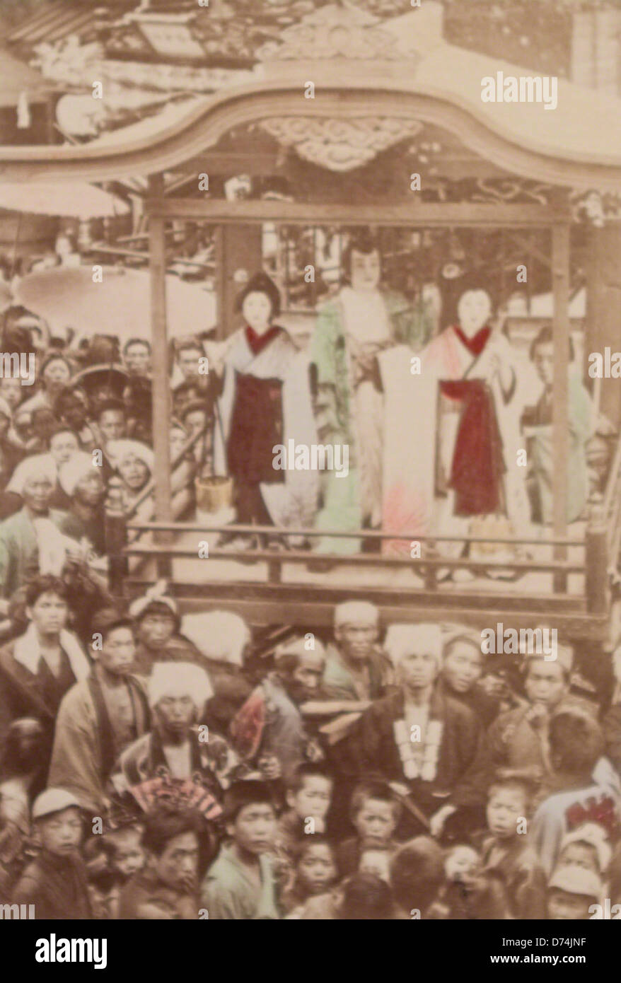 This image shows a group of dancing girls performing on a temple stage ...