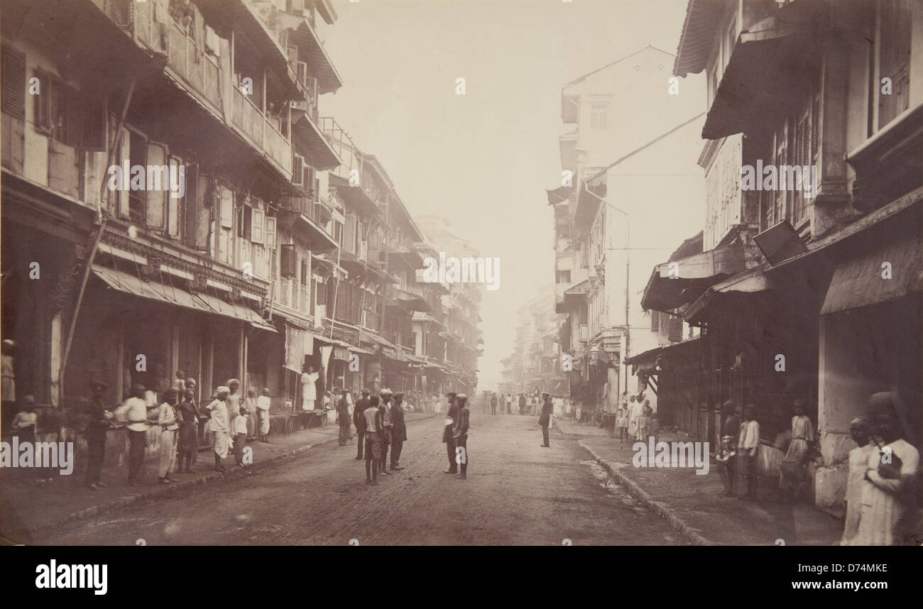 This photograph depicts a street scene, likely from Calcutta, India ...