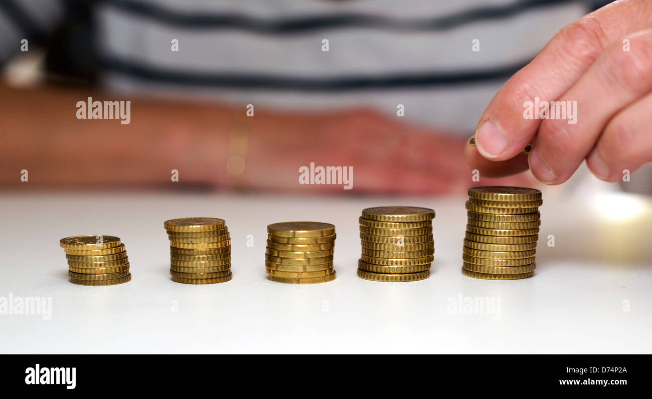euro coins with human hand Stock Photo - Alamy