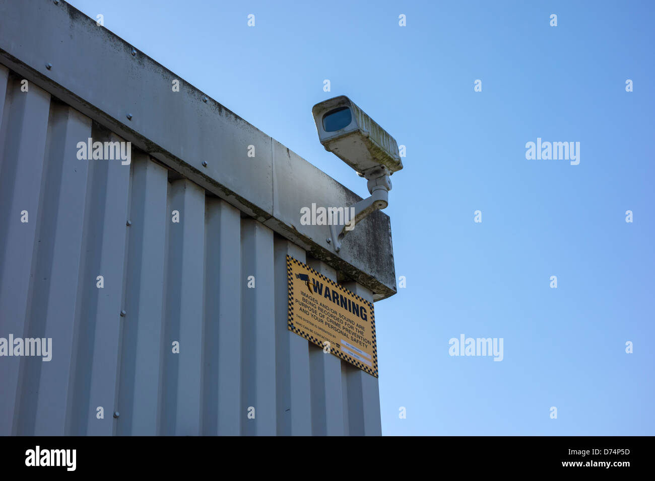 Dirty CCTV camera with green residue, providing security to the side of ...