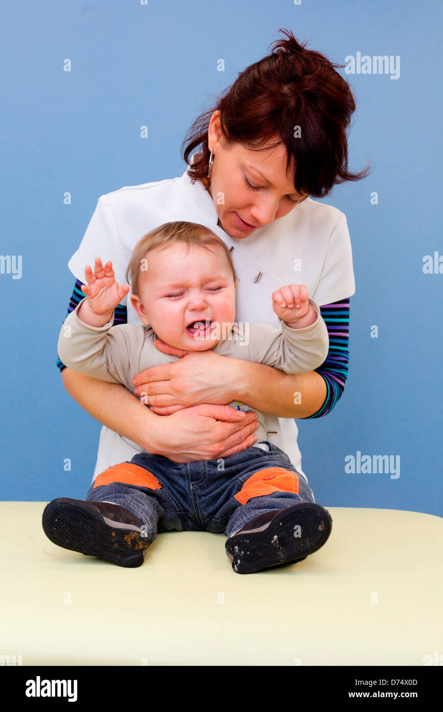 Physical Therapist performing respiratory physiotherapy on baby Stock ...