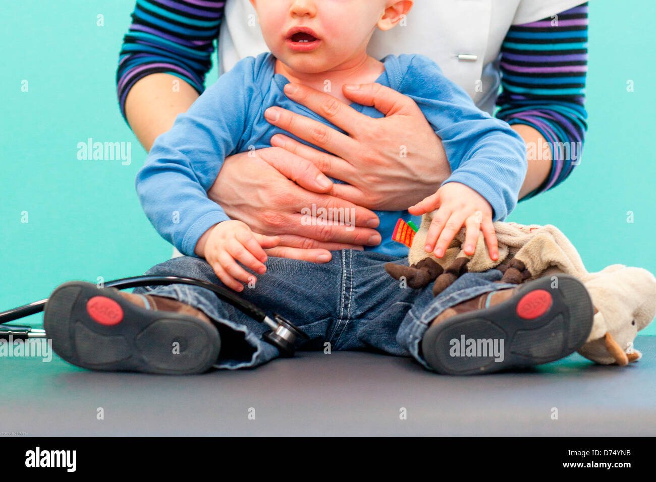 Physical Therapist performing respiratory physiotherapy on baby Stock ...