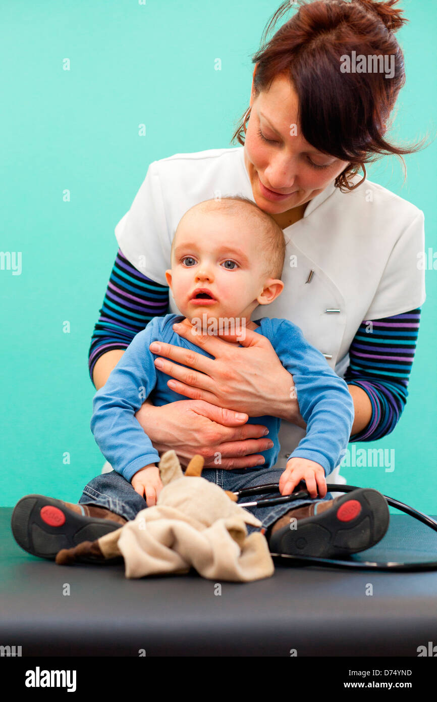 Physical Therapist performing respiratory physiotherapy on baby Stock ...