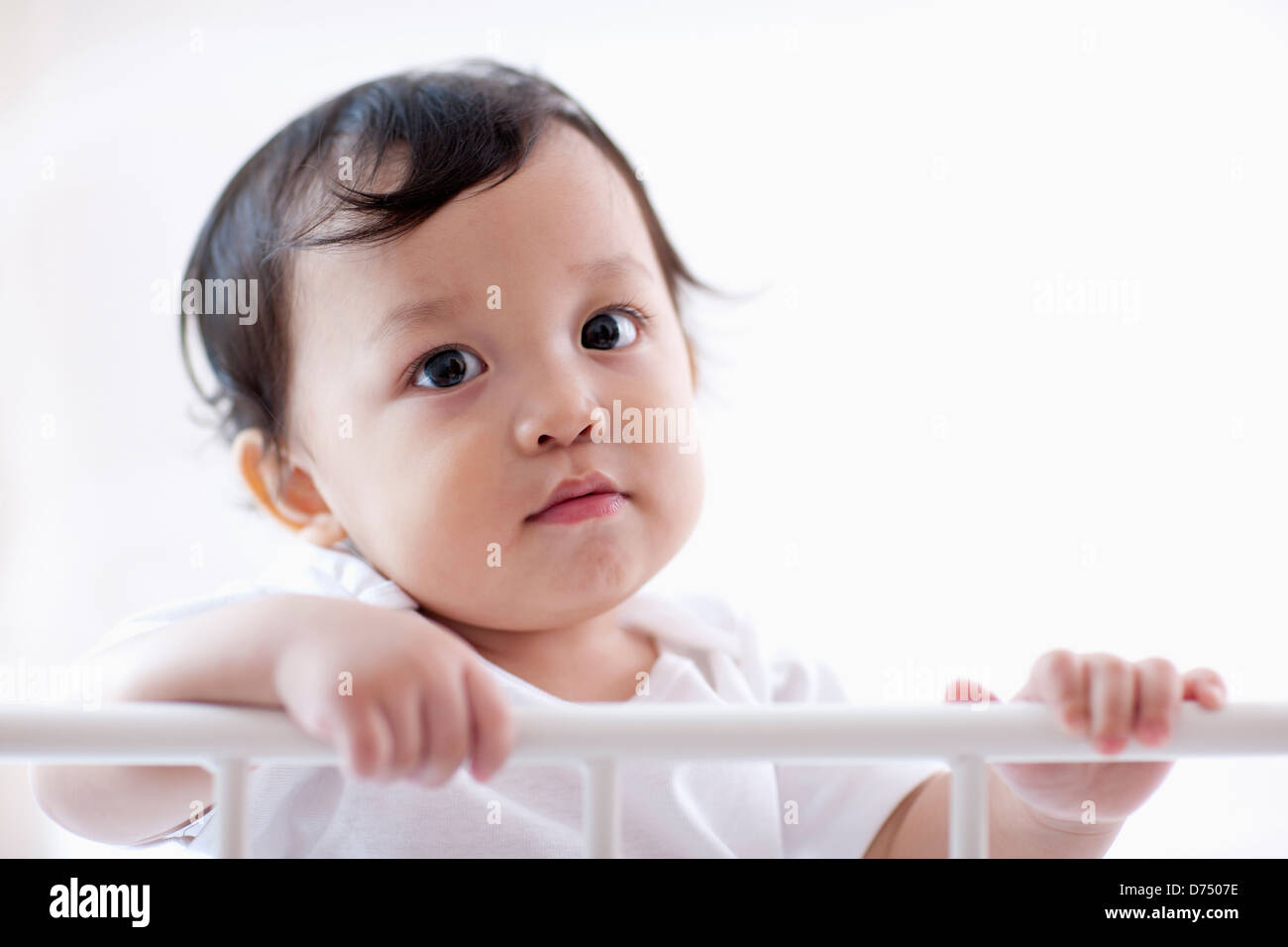a baby inside a crib Stock Photo - Alamy