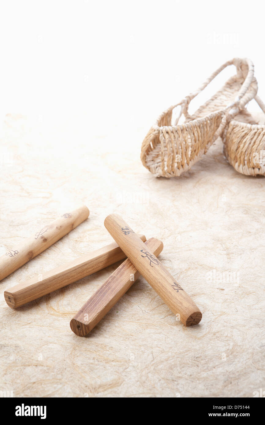 Yut sticks and Korean traditional shoes Stock Photo - Alamy
