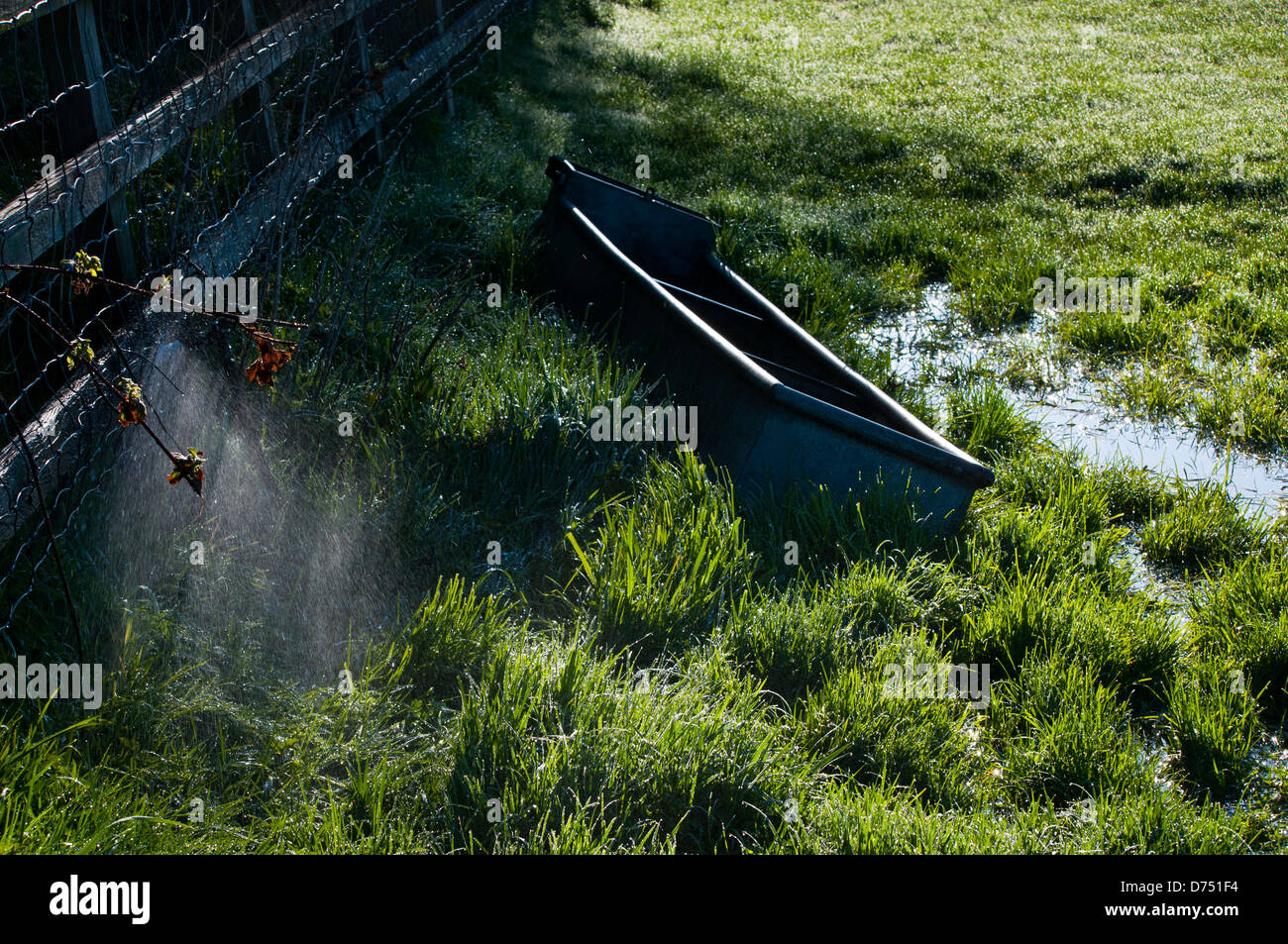 Water trough in field Stock Photo - Alamy