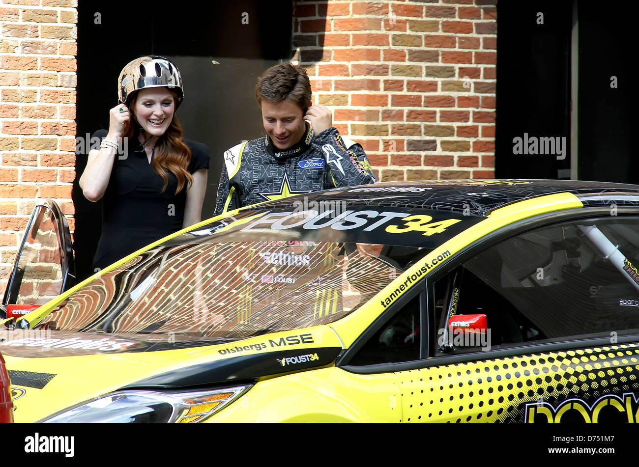 Julianne Moore and Tanner Foust Julianne Moore wearing a helmet as she ...