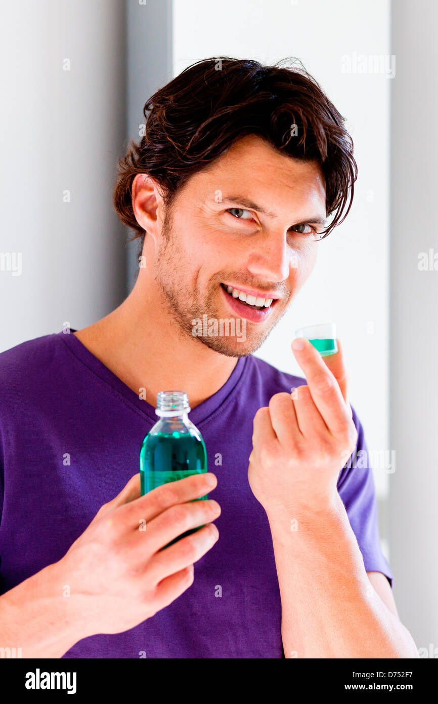 woman taking syrup Stock Photo - Alamy