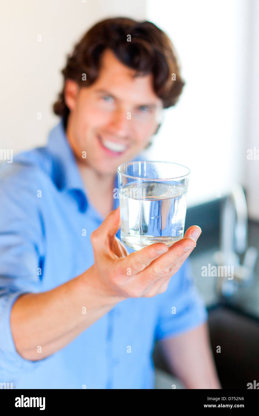 Man drinking glass of water Stock Photo - Alamy