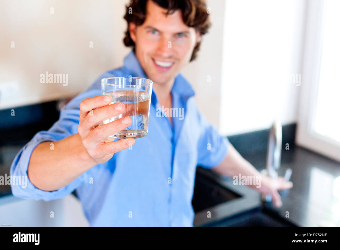 Man drinking glass of water Stock Photo - Alamy