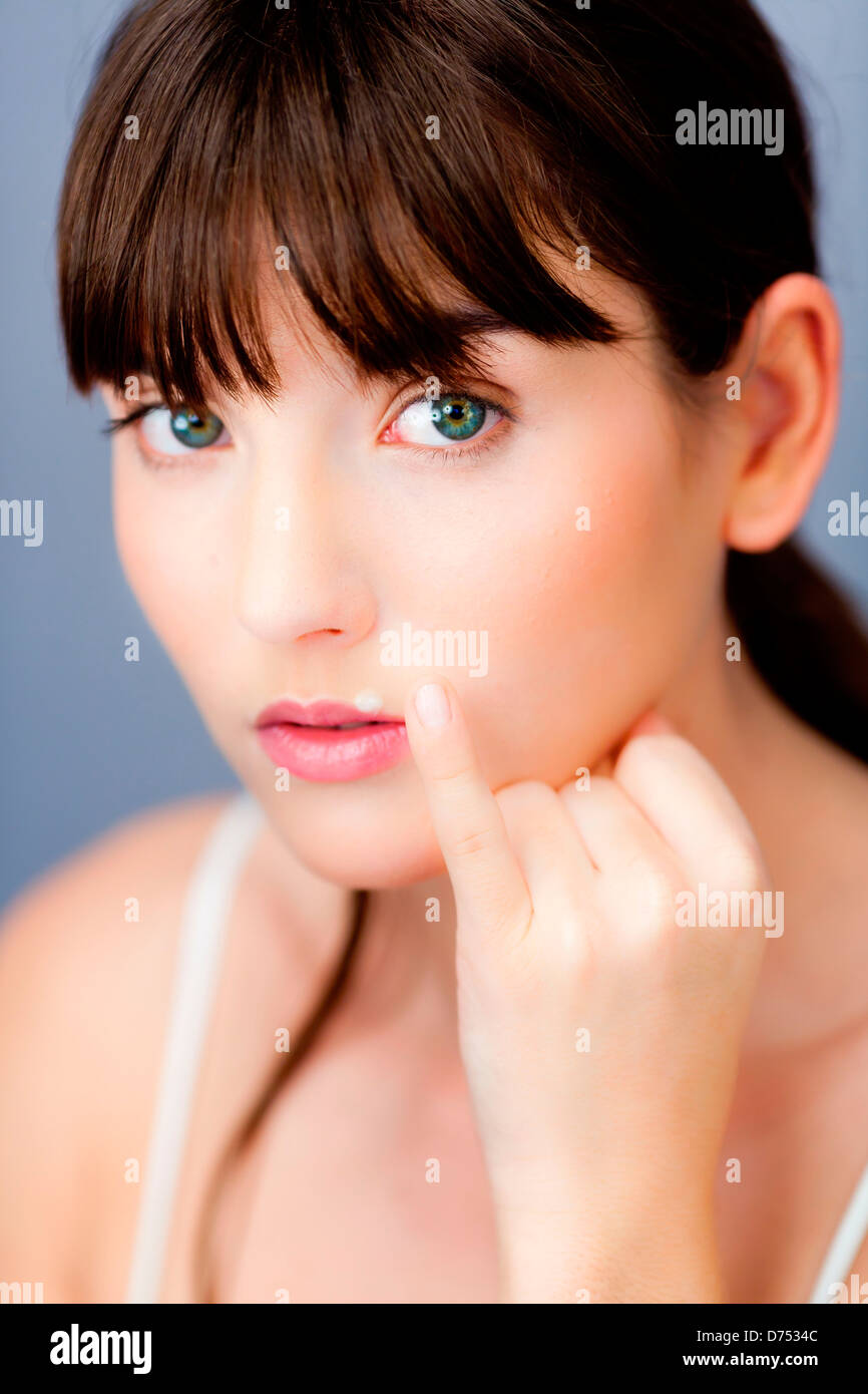 Woman applying ointment on lips hi-res stock photography and images - Alamy