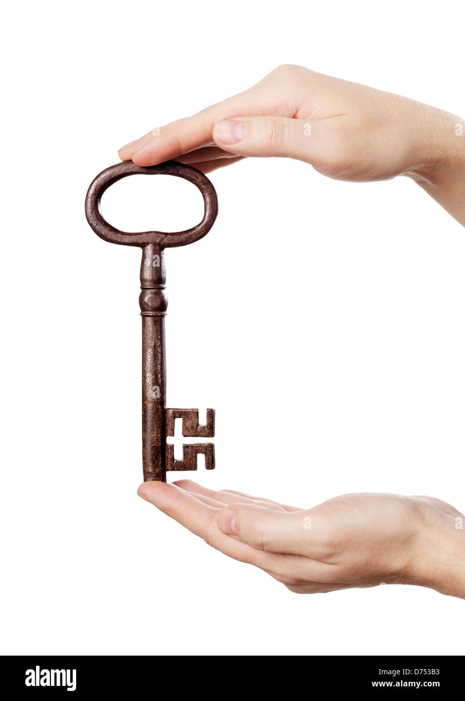 Man holding a big antique key between his hands Stock Photo - Alamy