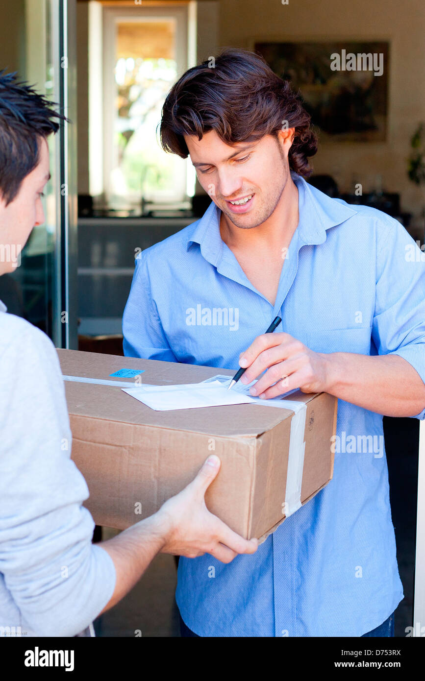 Man receiving package Stock Photo - Alamy