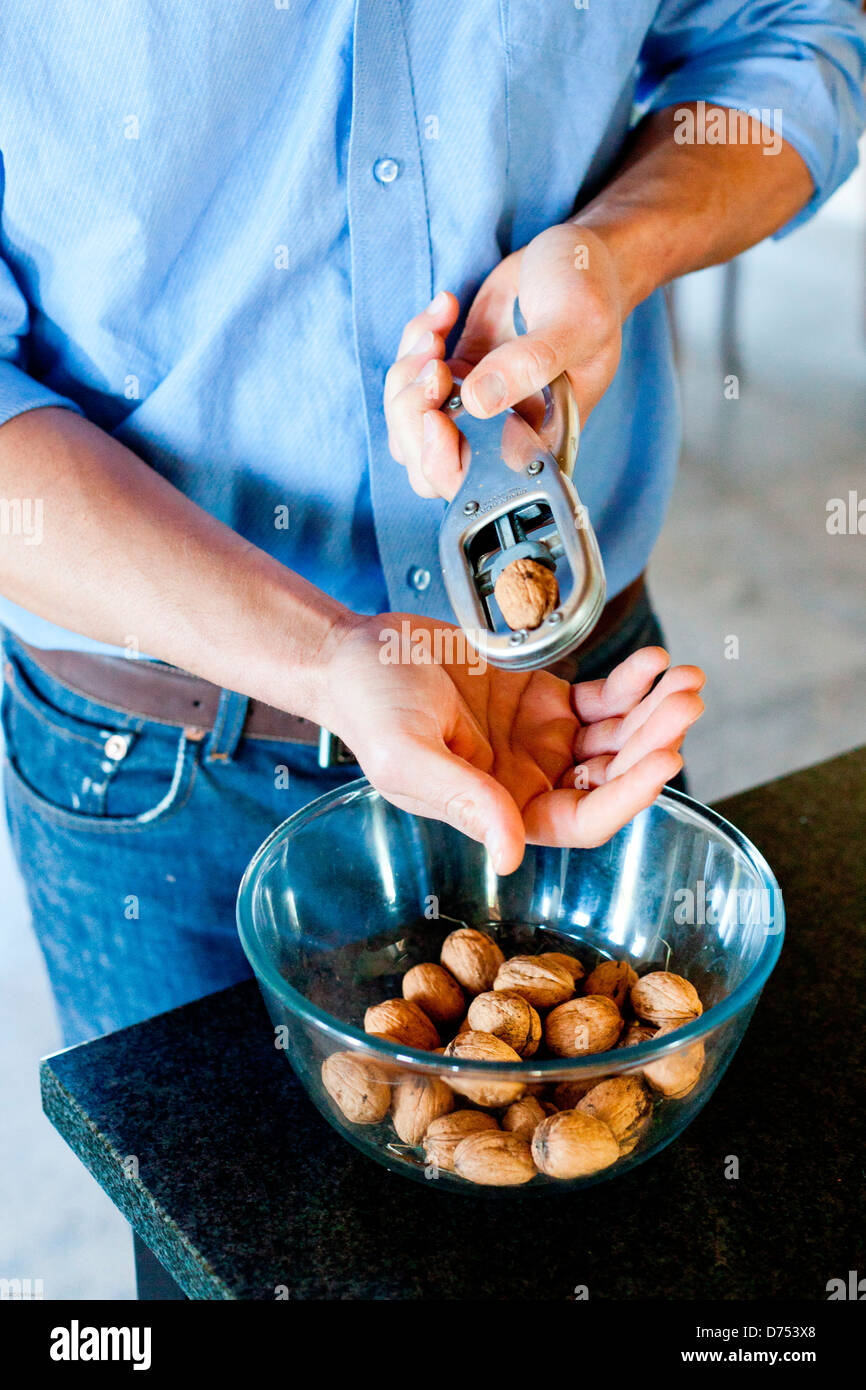 Man eating walnuts Stock Photo - Alamy