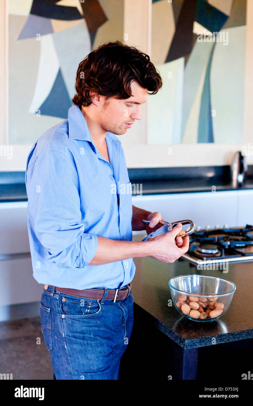 Man eating walnuts Stock Photo - Alamy