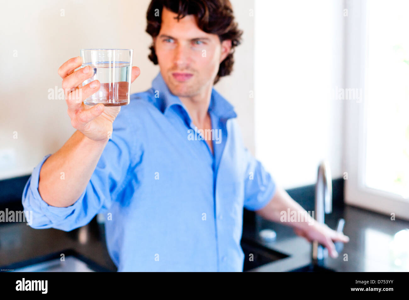 Man drinking glass of water Stock Photo - Alamy