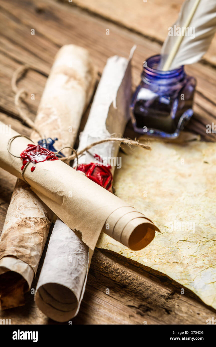Closeup of ancient scrolls writing by feather with blue ink Stock Photo ...