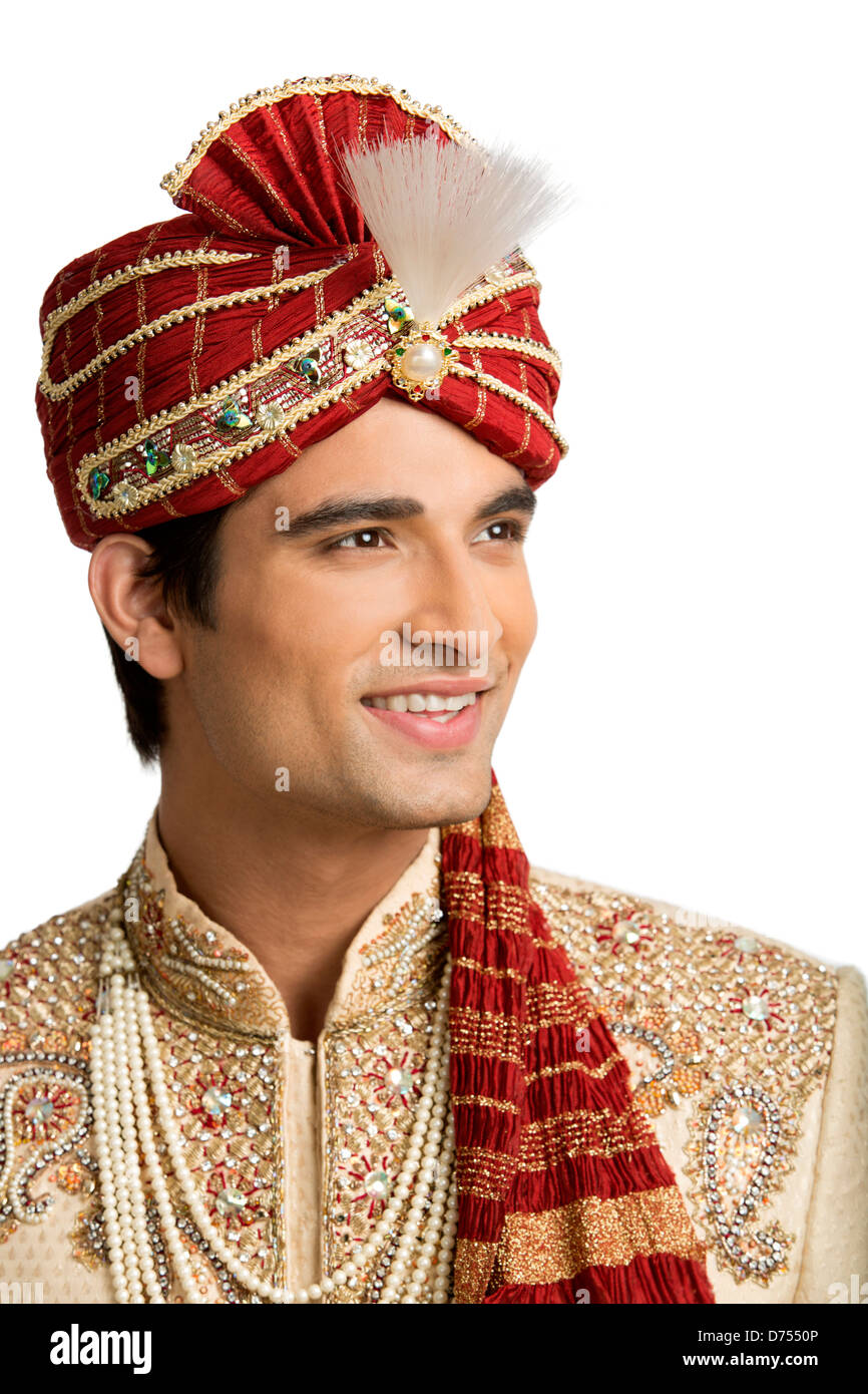 Smiling Indian man in traditional wedding outfit Stock Photo - Alamy
