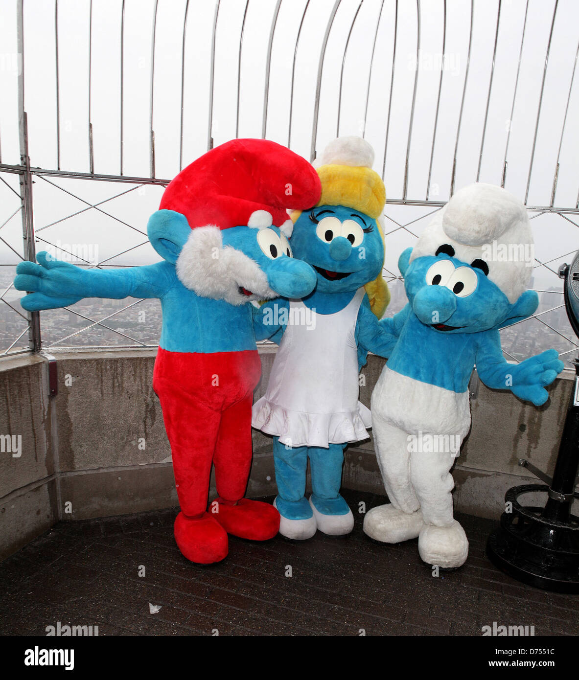 Smurfs attend the switching on of the lights at the Empire State ...