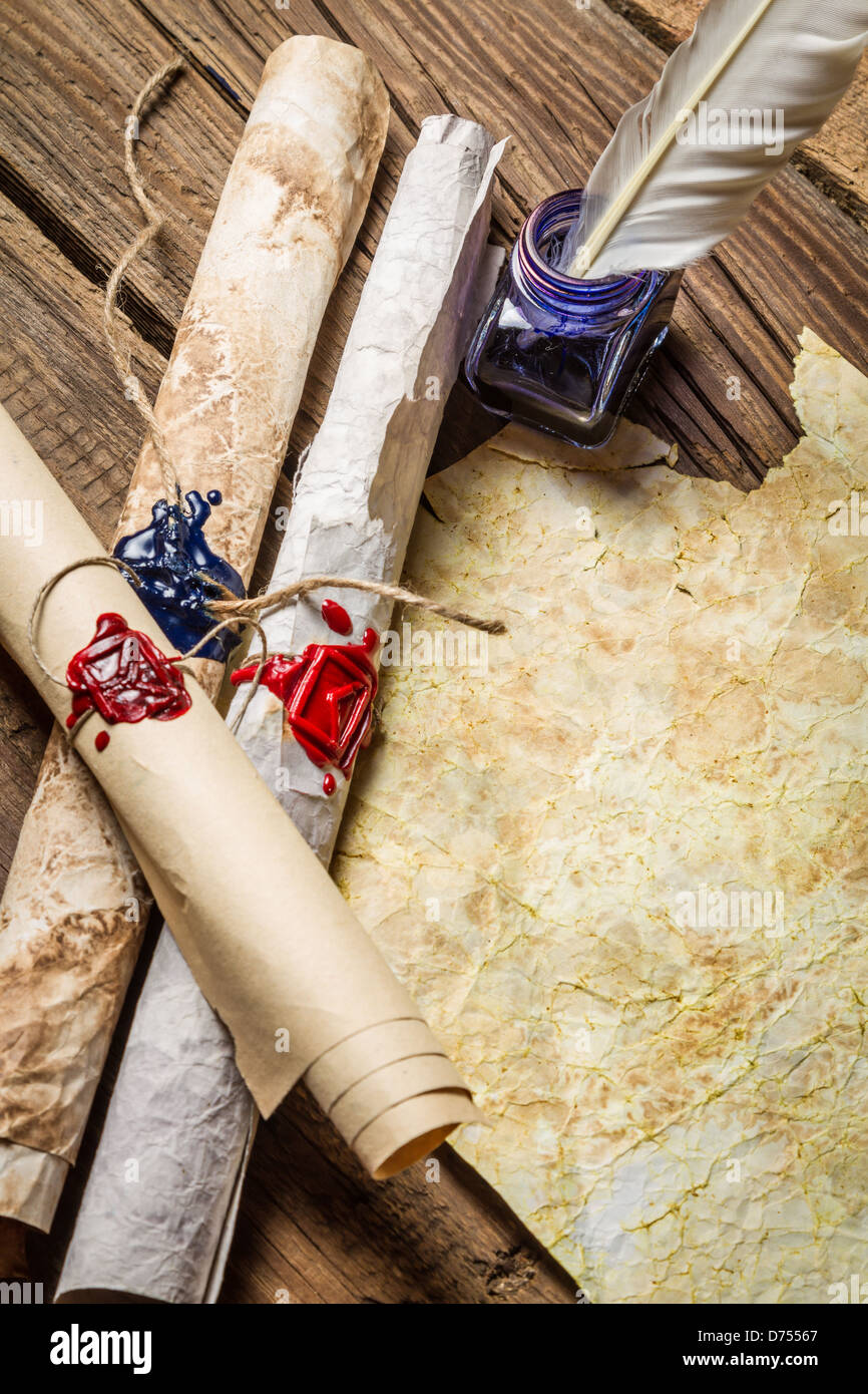 Ancient scrolls writing by feather with blue ink Stock Photo - Alamy