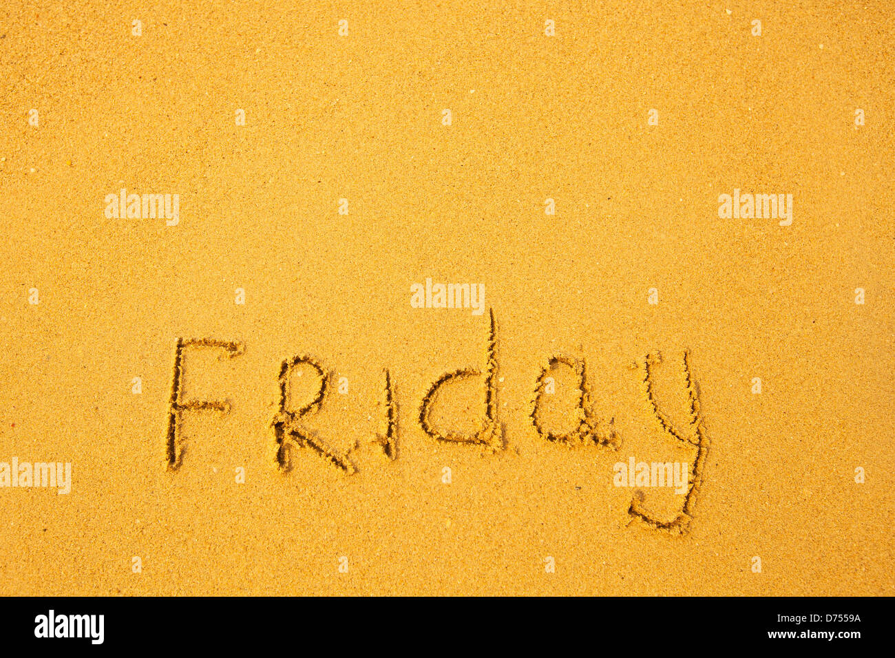 Friday - written in sand on beach texture Stock Photo - Alamy