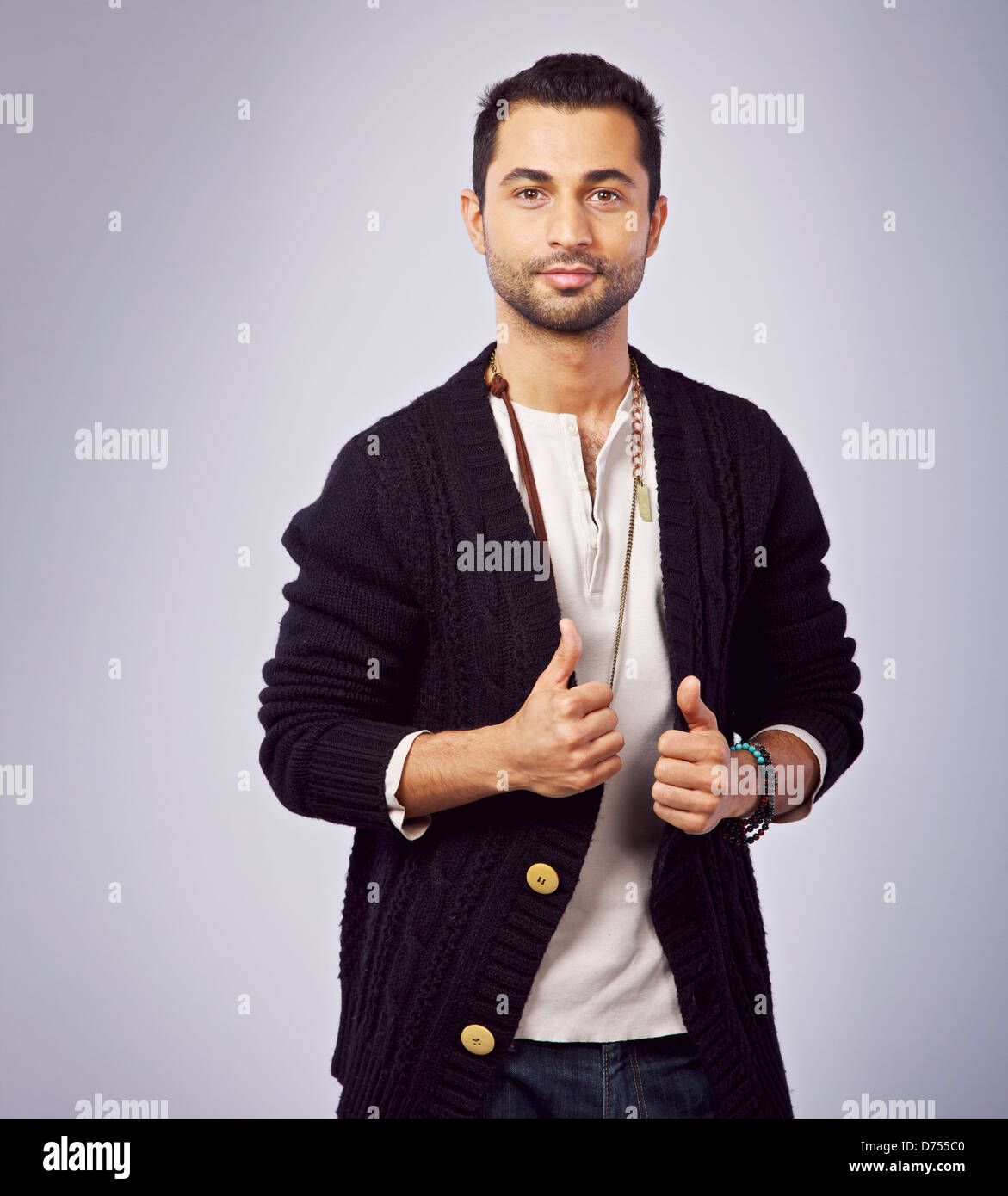 Friendly guy gesturing with a thumbs up sign Stock Photo - Alamy