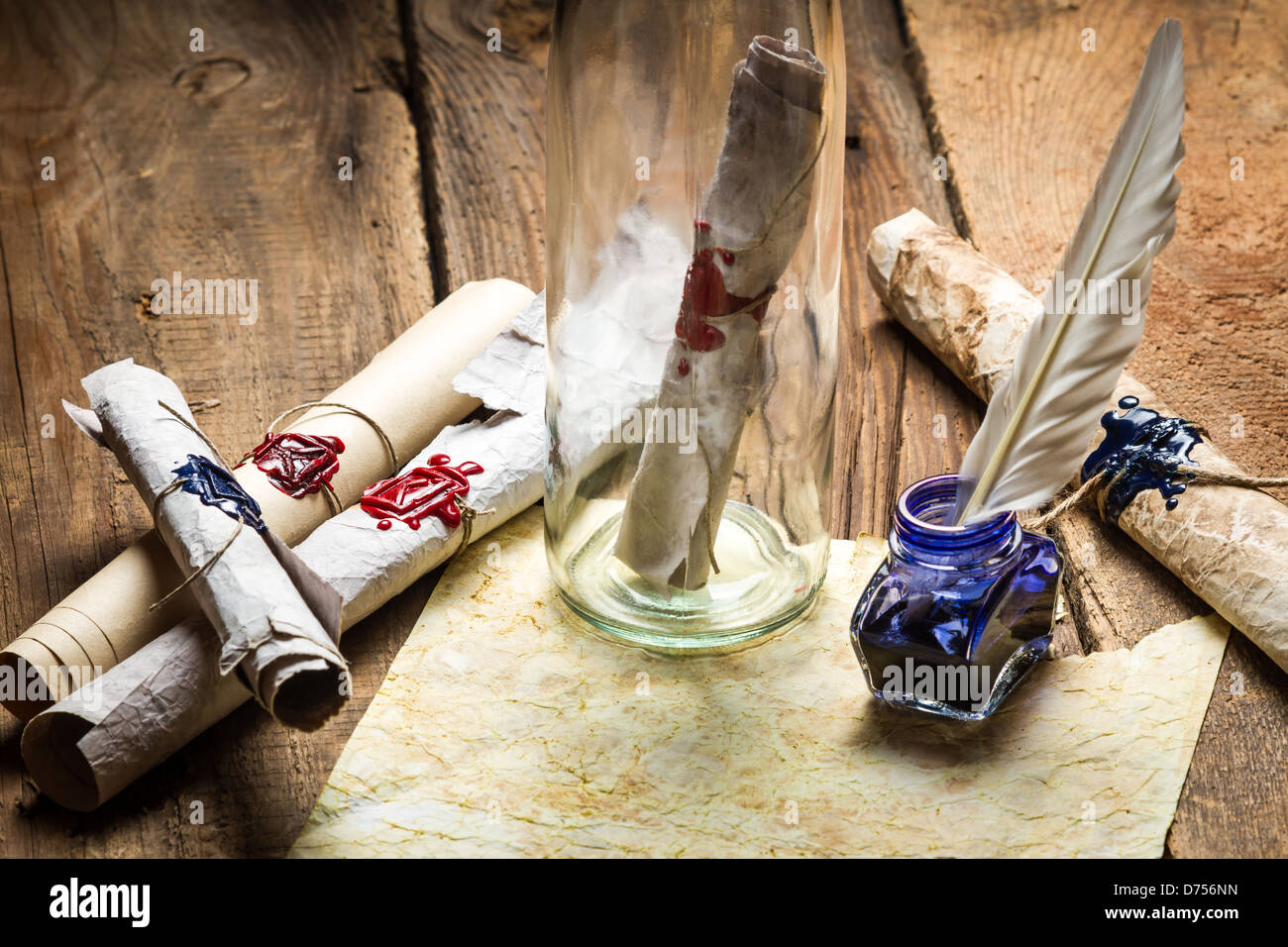 Writing ancient letter and send it in a bottle Stock Photo - Alamy