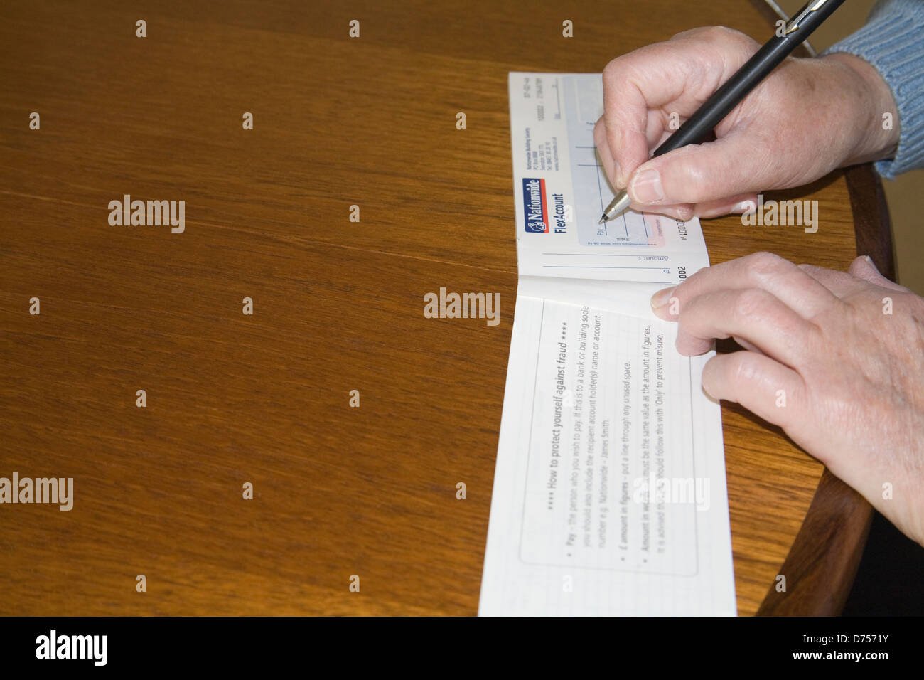 Writing a cheque hi-res stock photography and images - Alamy